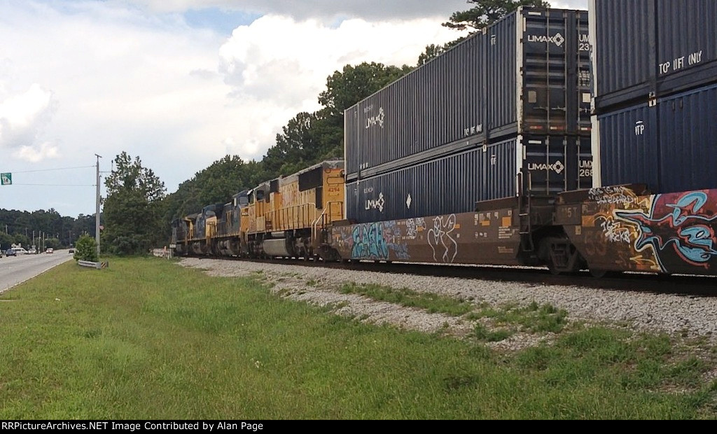 CSX AC44CW 244 leads sister-unit 279, C40-8W 7926, and UP SD70M 4294 to a stop